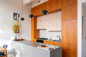 Tall Kitchen Pantry Cabinets Create a Full Wall Effect | Sweeten